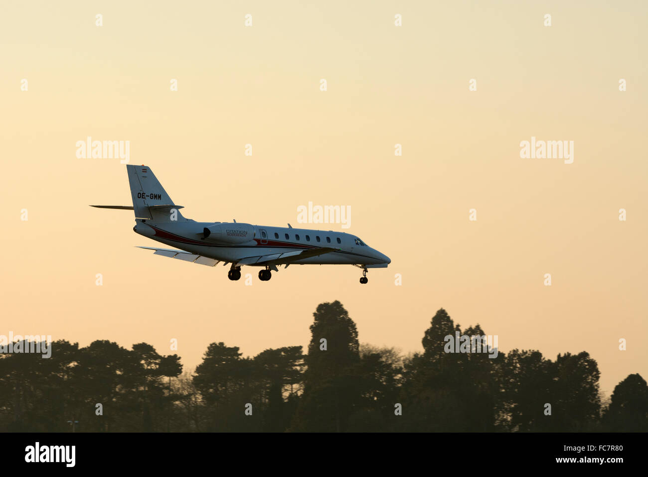 Cessna Citation 680 Sovereign landing at Birmingham Airport at dusk, UK ...