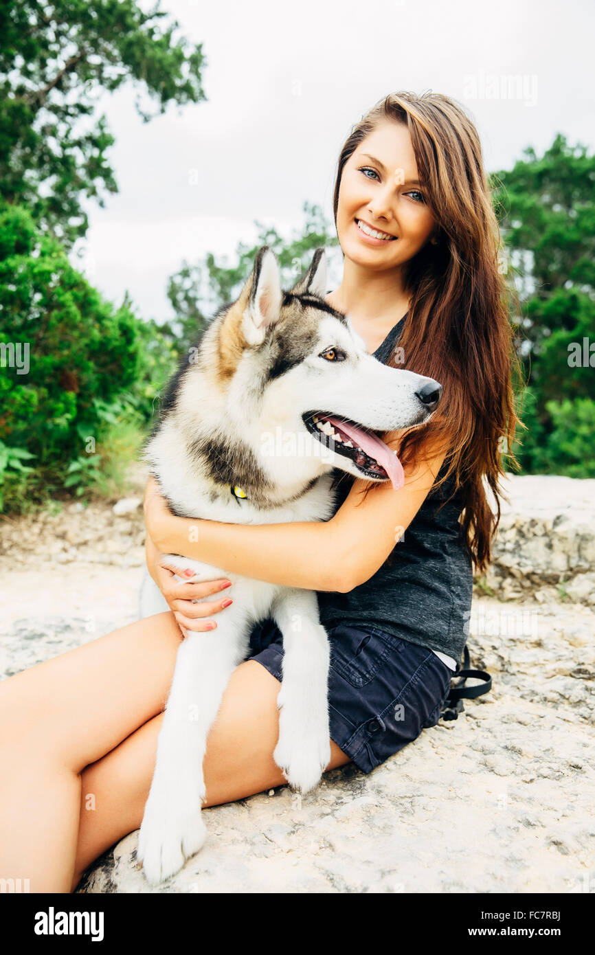 Caucasian woman petting dog outdoors Stock Photo - Alamy
