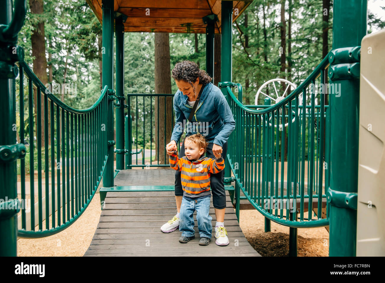 Caucasian mother and son playing on playground Stock Photo - Alamy