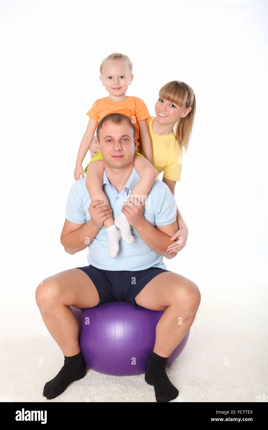 family together doing sport indoors in sportwear Stock Photo - Alamy