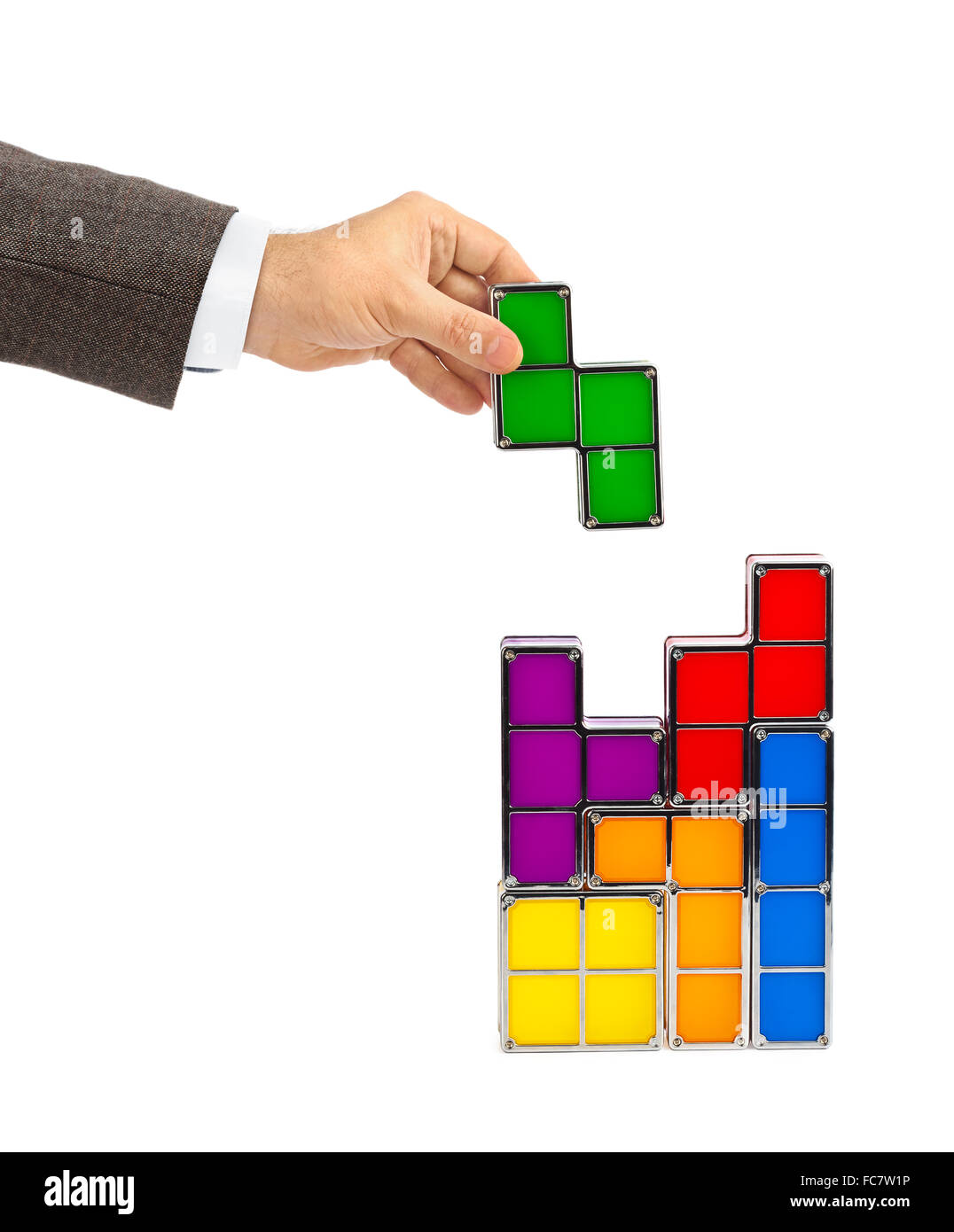 Hand with tetris toy blocks Stock Photo - Alamy