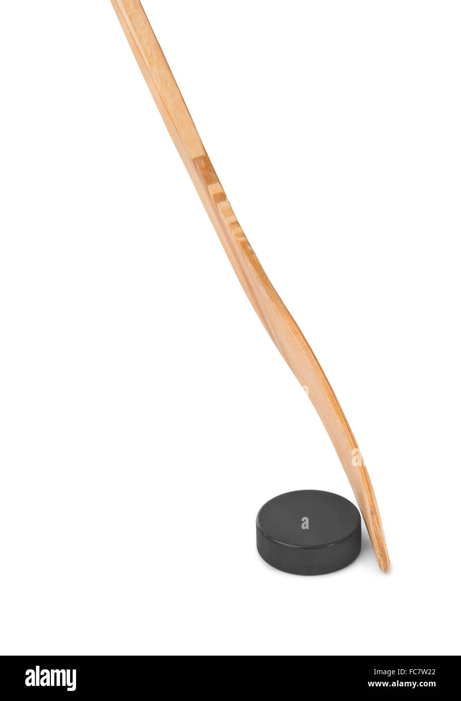 Ice hockey stick and puck Stock Photo - Alamy