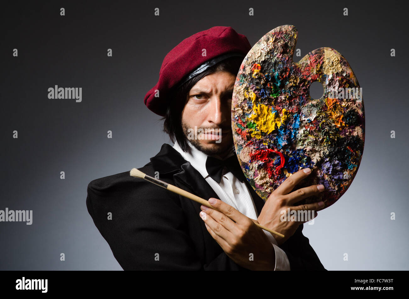 Funny artist working in the studio Stock Photo - Alamy