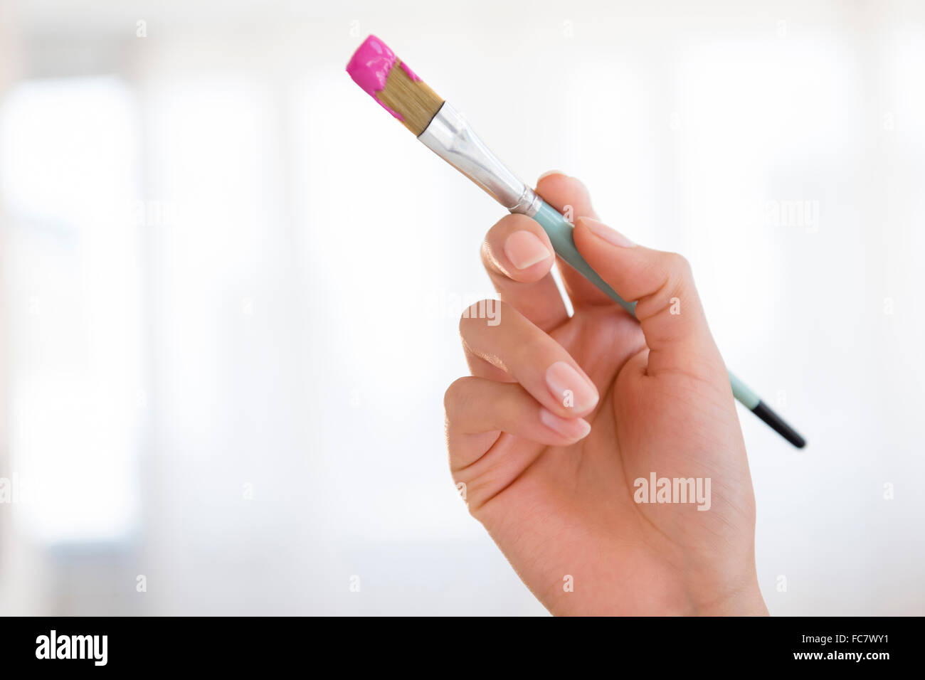 Human hand holding paint brush hi-res stock photography and images - Alamy