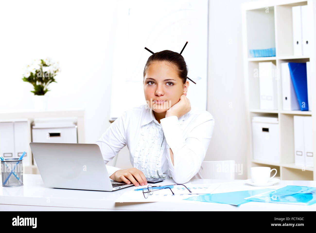 POrtrait of a young beautiful woman in business wear at work Stock ...