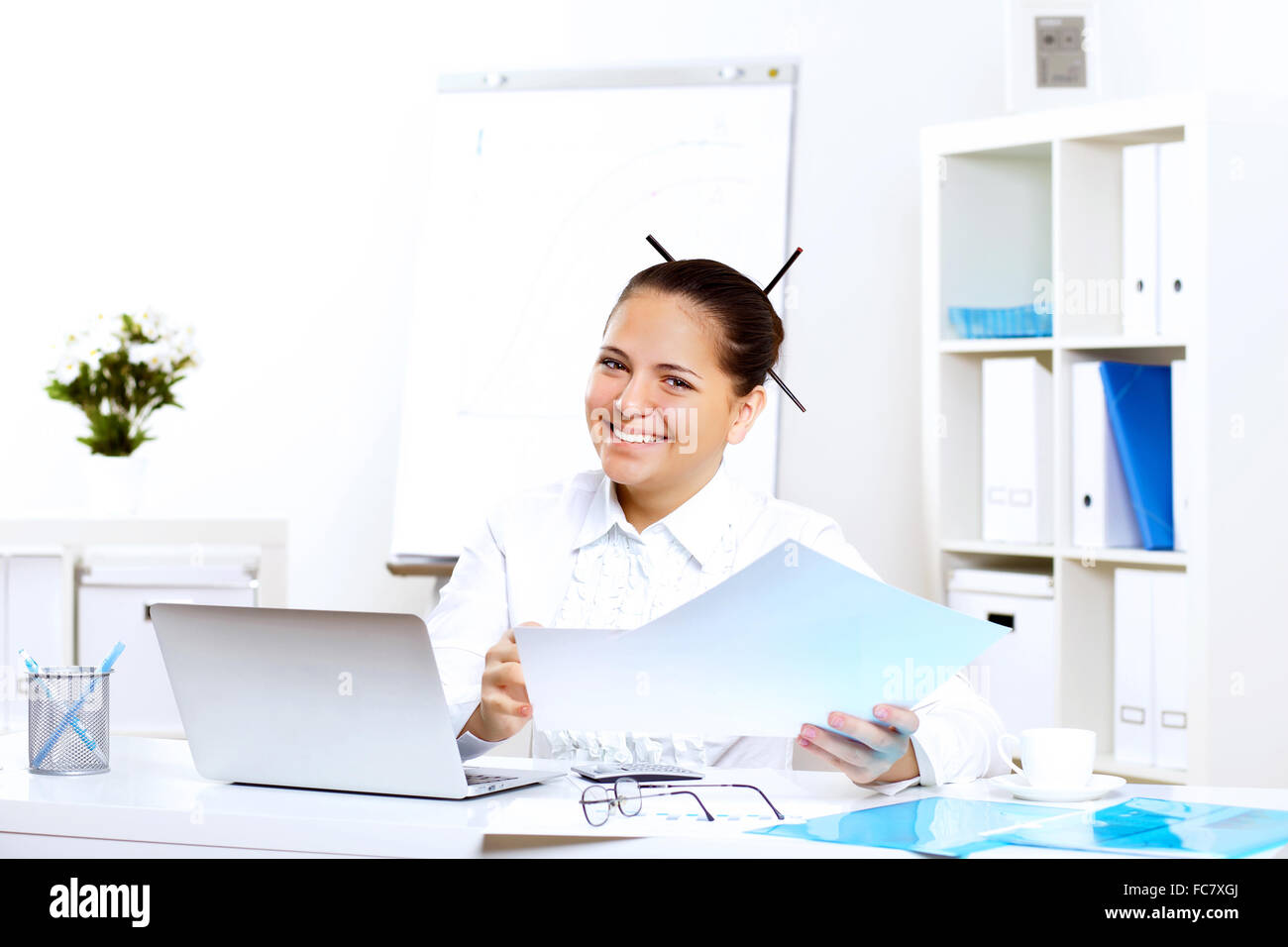 POrtrait of a young beautiful woman in business wear at work Stock ...