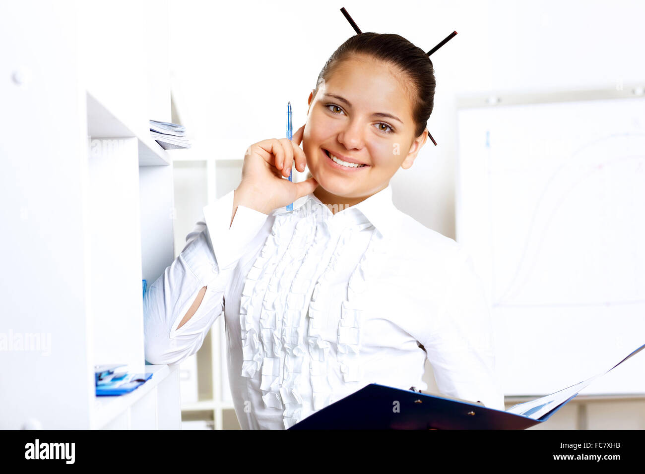 POrtrait of a young beautiful woman in business wear at work Stock ...