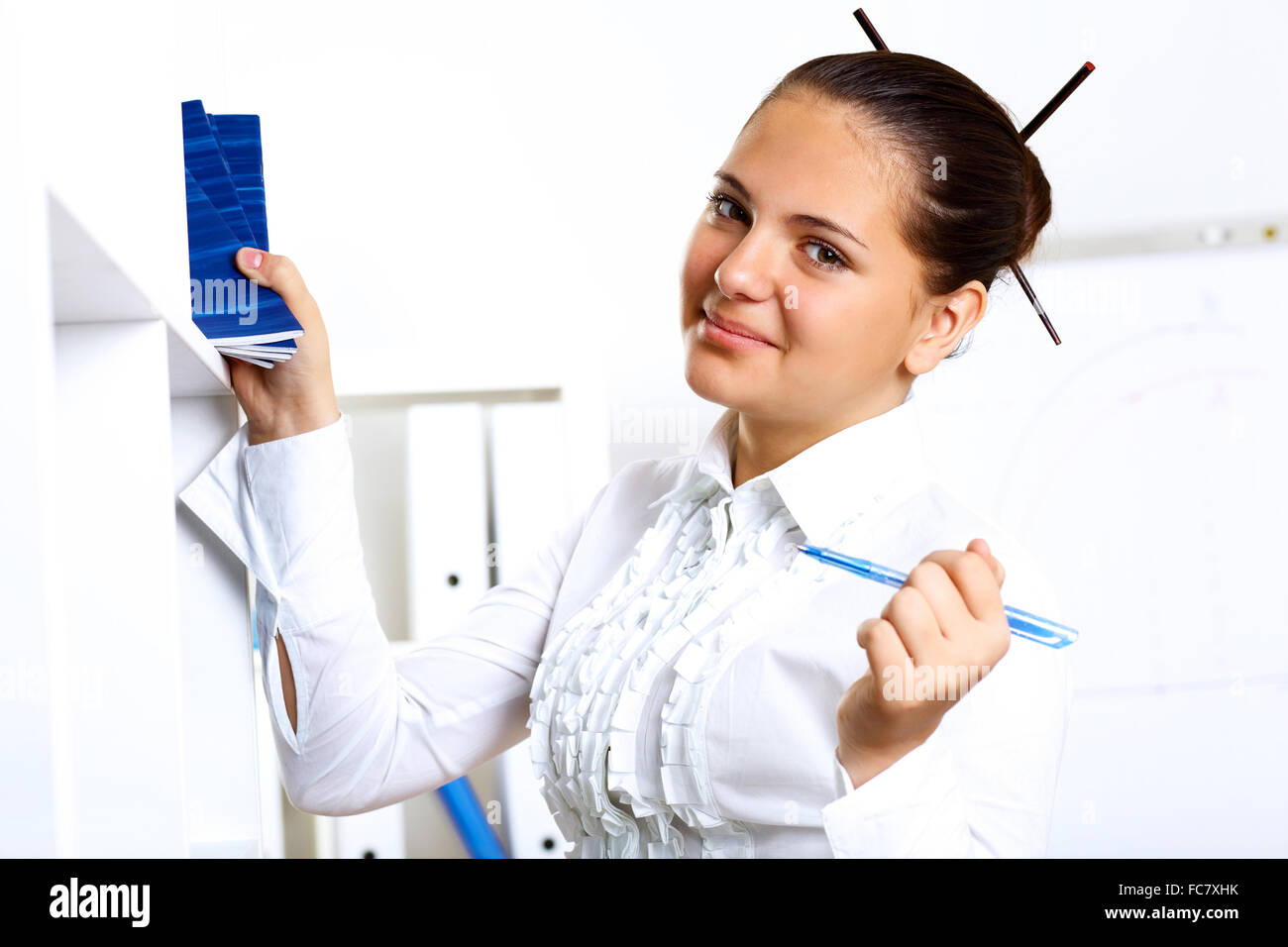 POrtrait of a young beautiful woman in business wear at work Stock ...