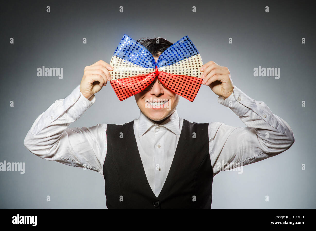 Funny man with giant bow tie Stock Photo - Alamy