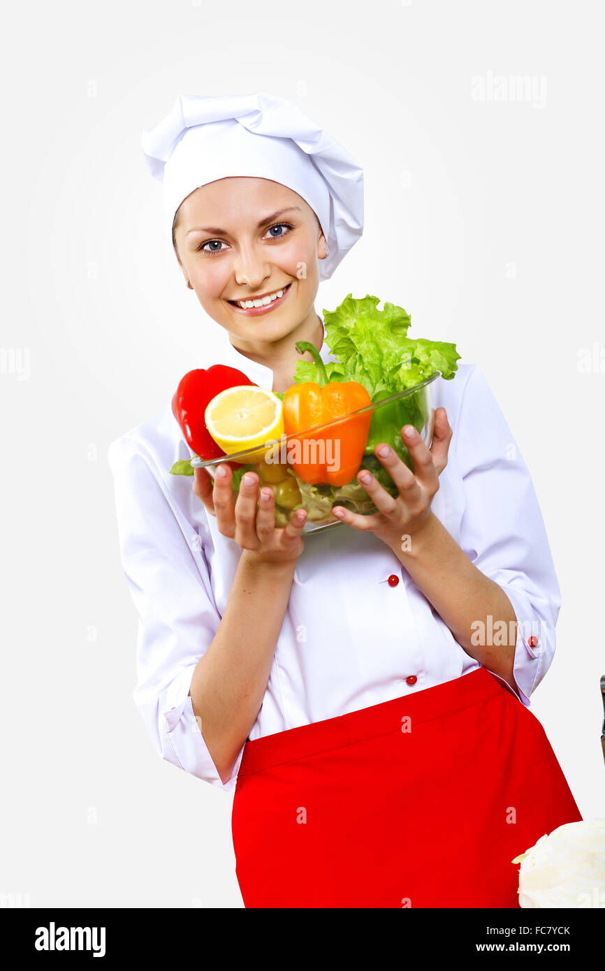 Portrait of a young cook in uniform preparing meal Stock Photo - Alamy