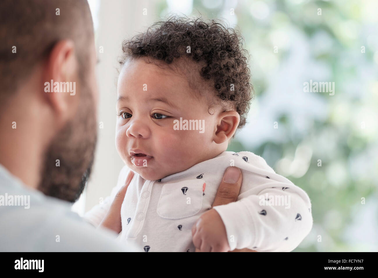 Father holding baby son Stock Photo - Alamy