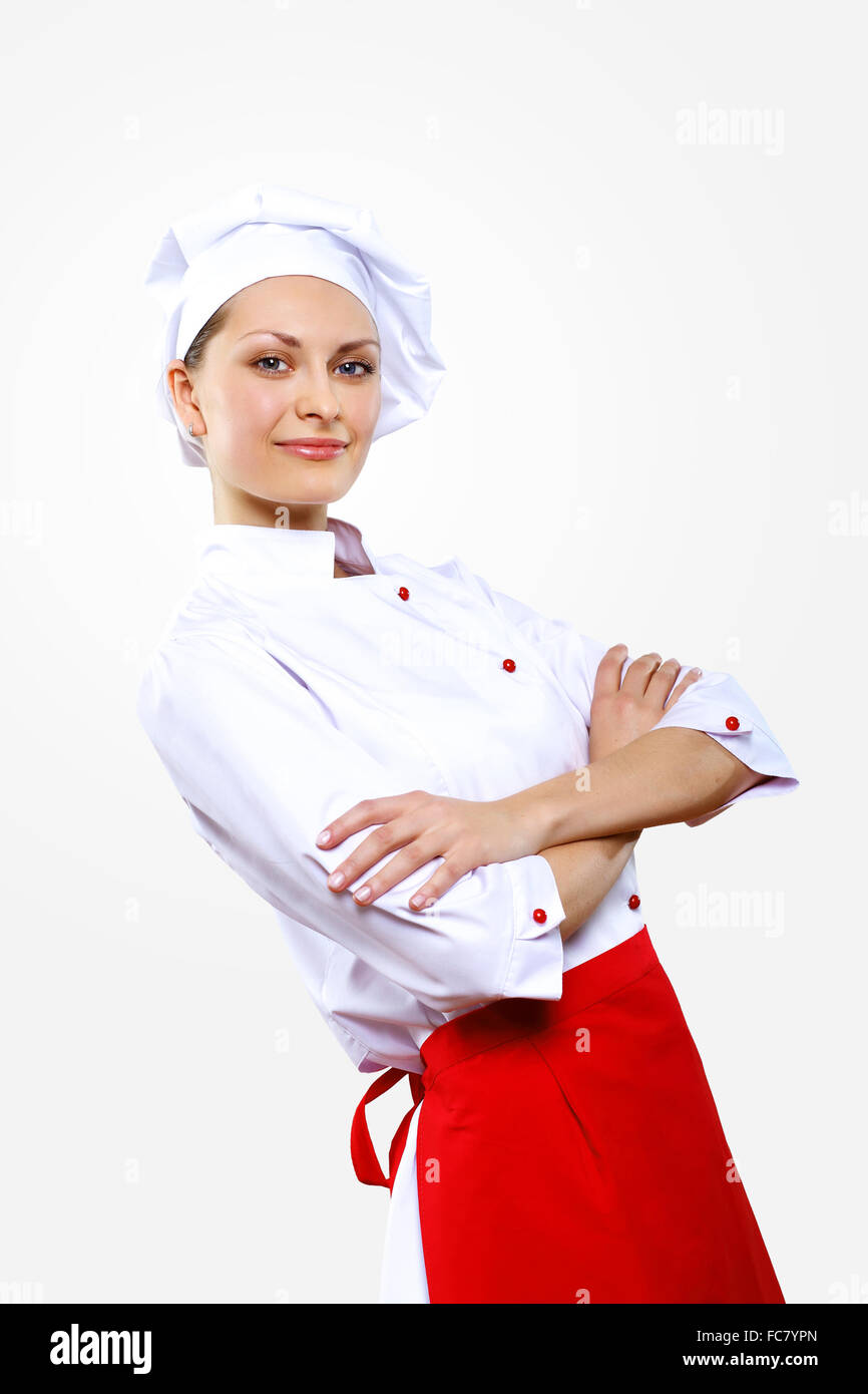 Portrait of a young cook in uniform preparing meal Stock Photo - Alamy
