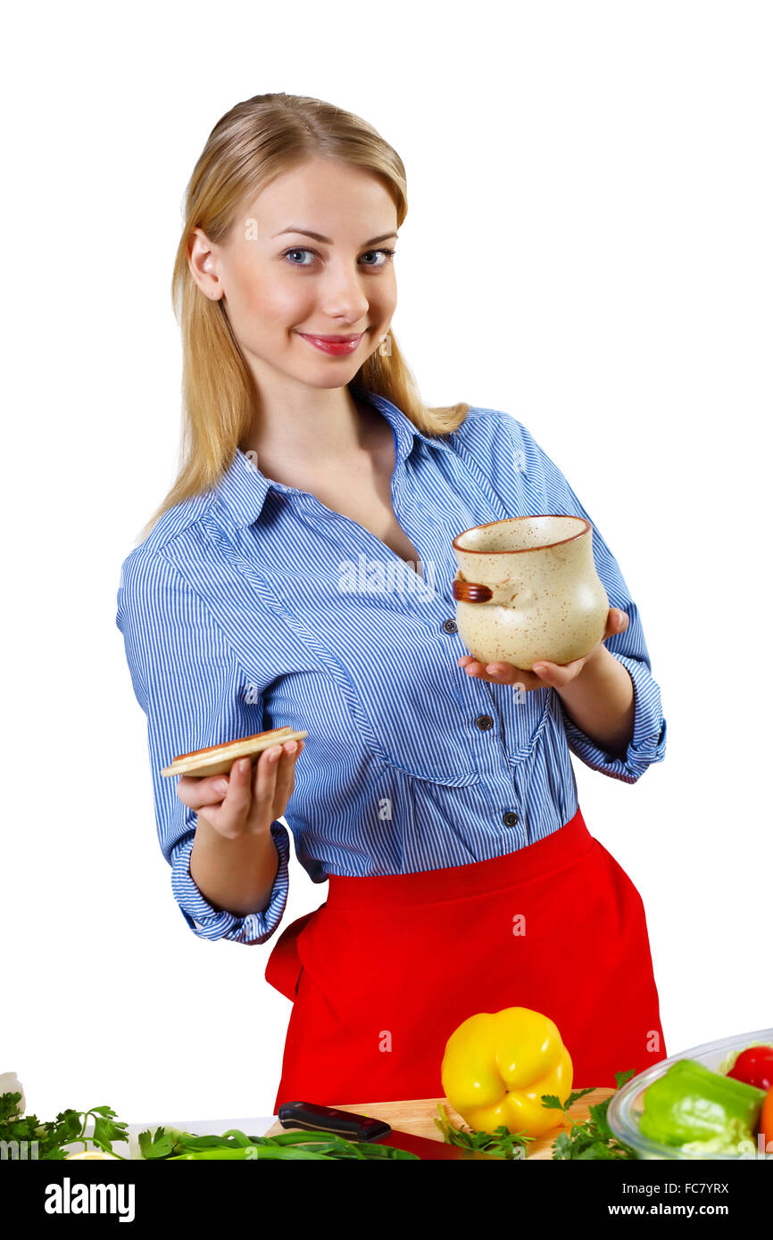 Young happy woman cooking fresh meal at home Stock Photo - Alamy