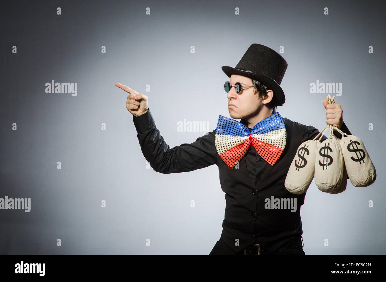 Funny man with money dollar sacks Stock Photo - Alamy