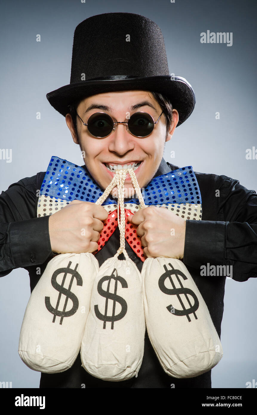 Funny man with money dollar sacks Stock Photo - Alamy