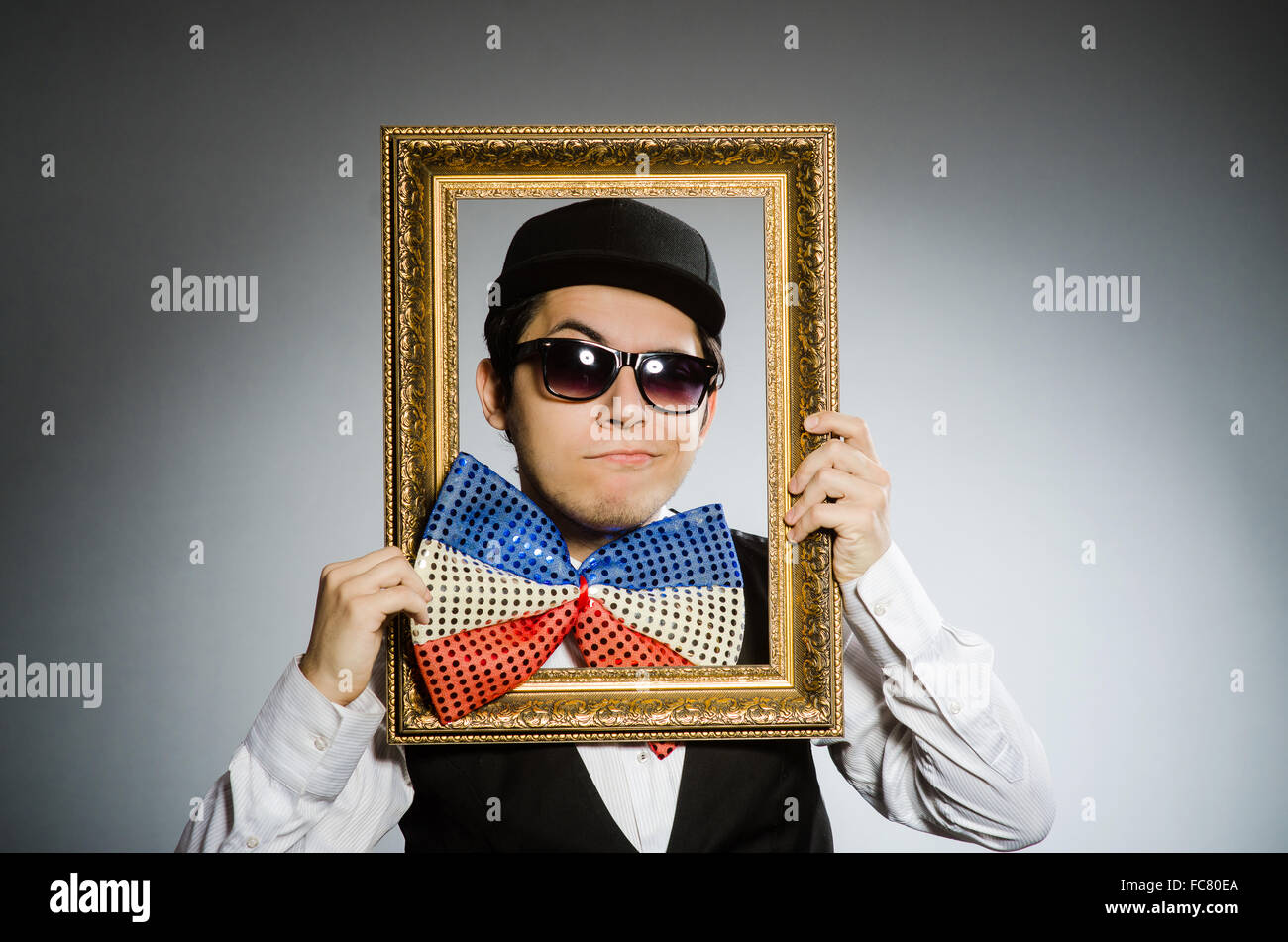 Funny man with picture frame Stock Photo - Alamy