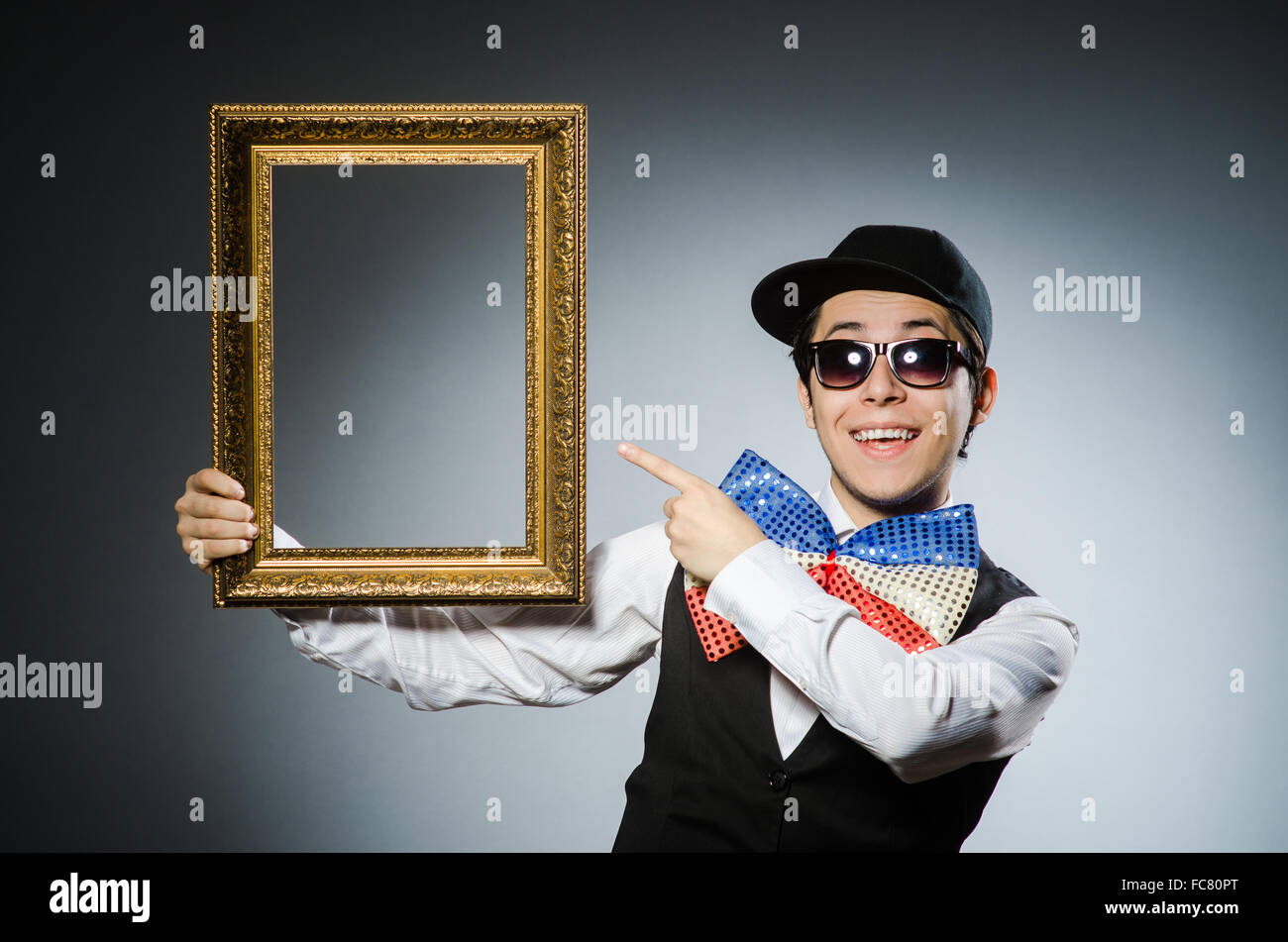 Funny man with picture frame Stock Photo - Alamy