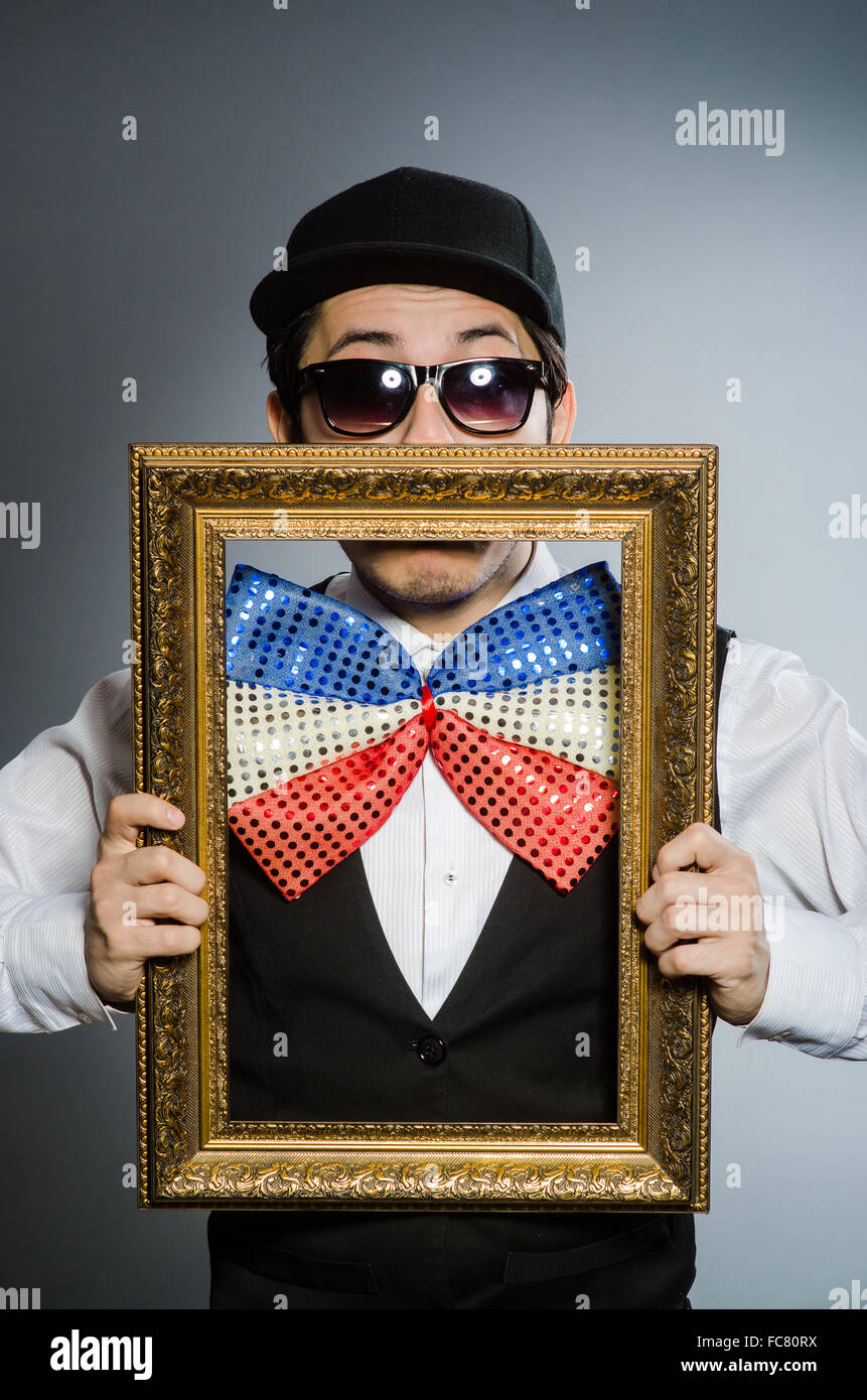 Funny man with picture frame Stock Photo - Alamy
