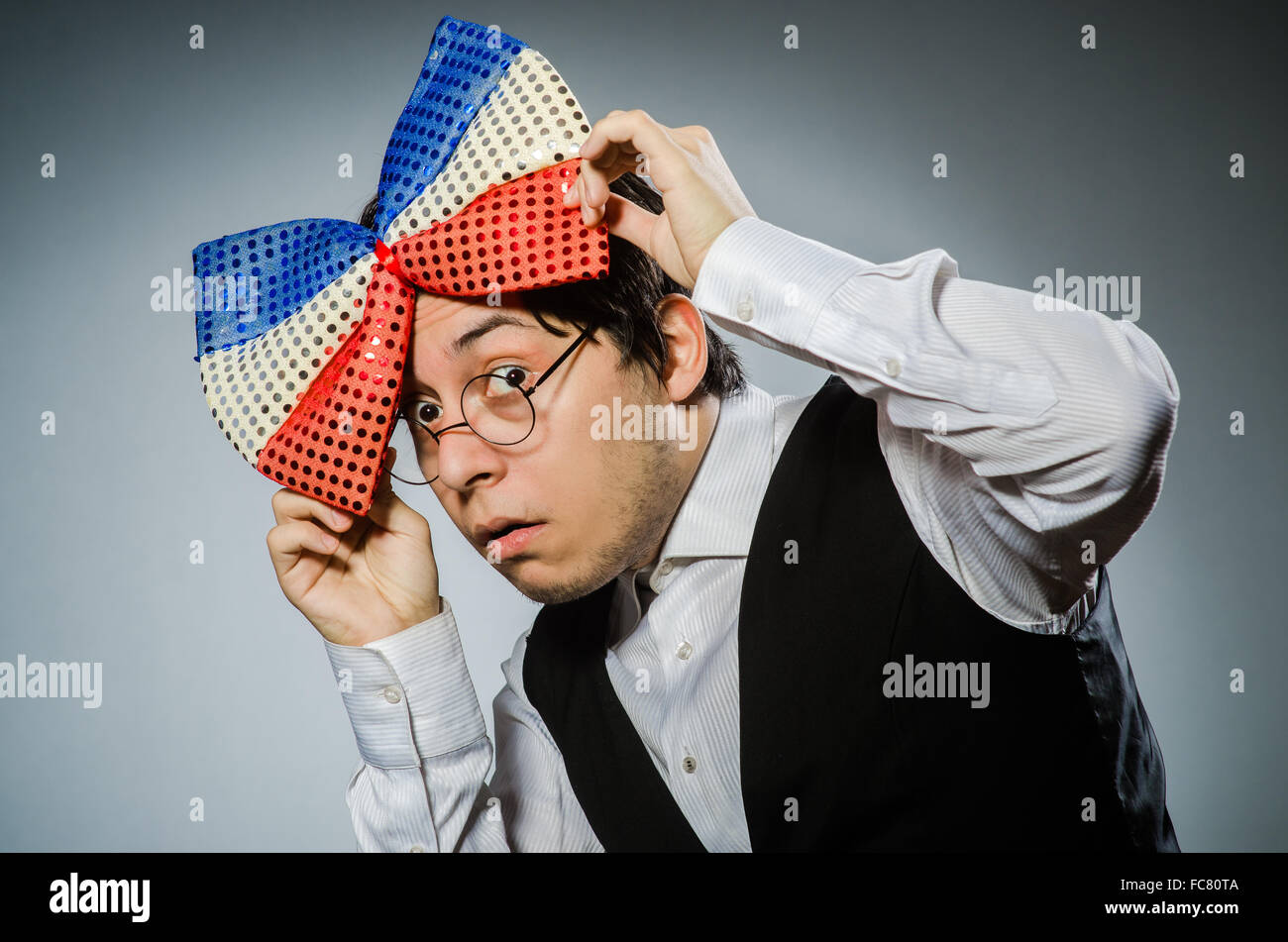 Funny man with giant bow tie Stock Photo - Alamy