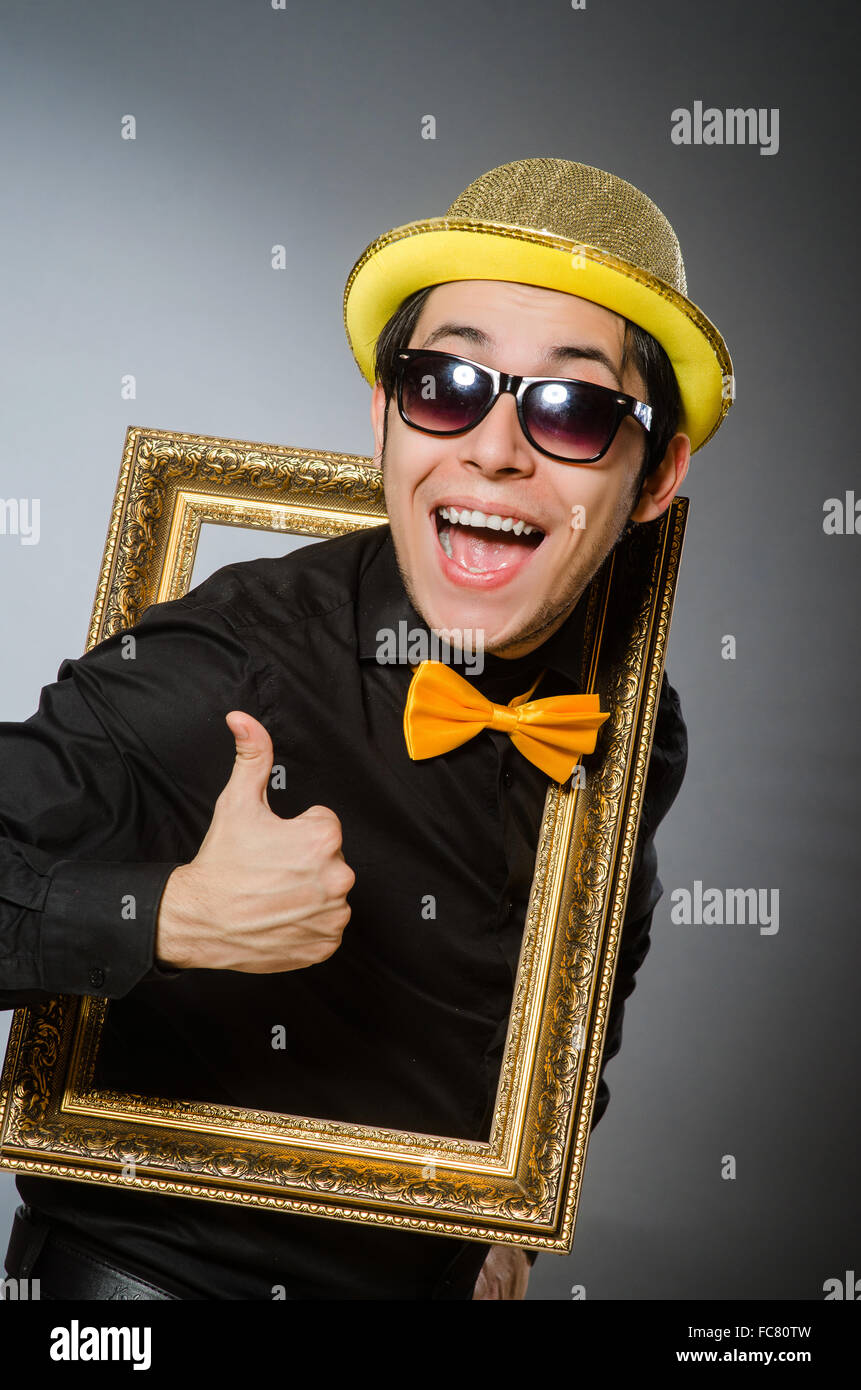 Funny man with picture frame Stock Photo - Alamy