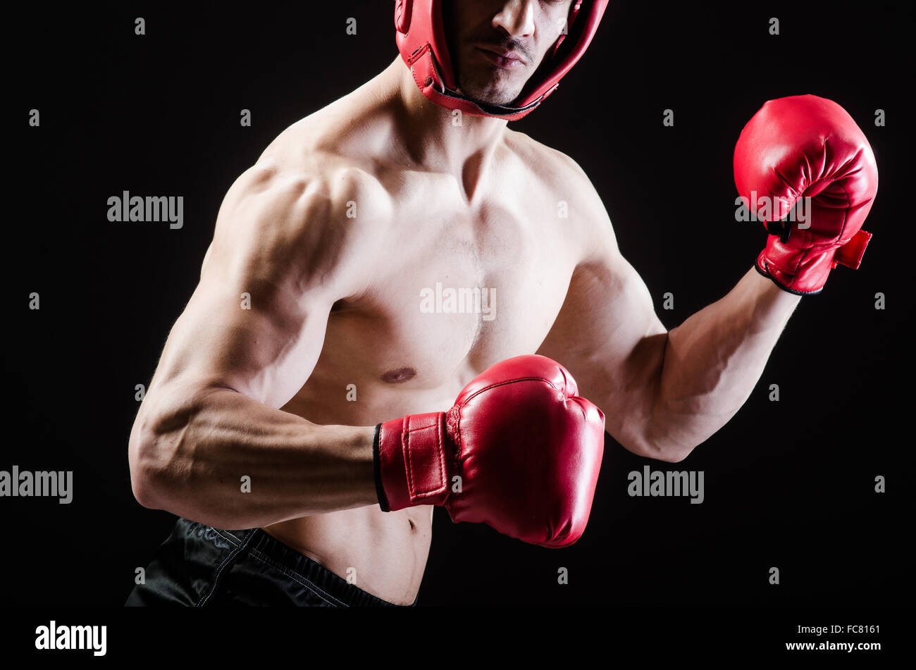 Muscular man in boxing concept Stock Photo - Alamy