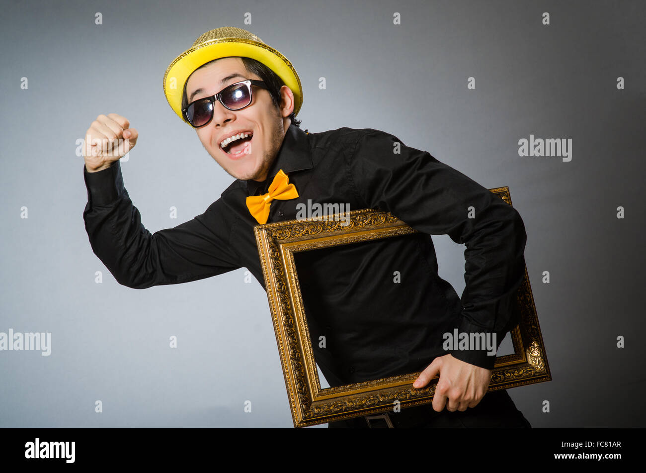 Funny man with picture frame Stock Photo - Alamy