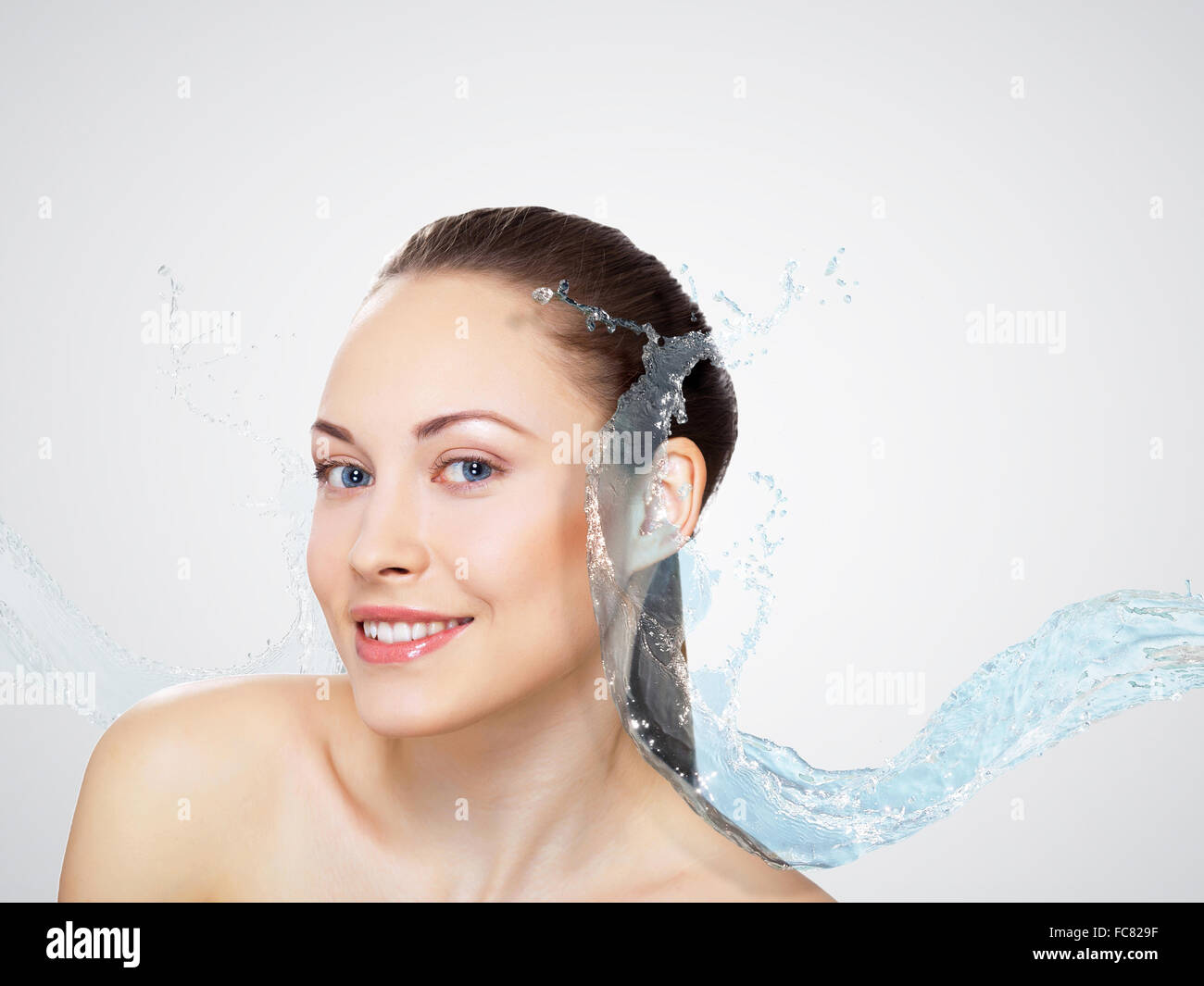 Portrait of beautiful young woman with water splashes Stock Photo - Alamy
