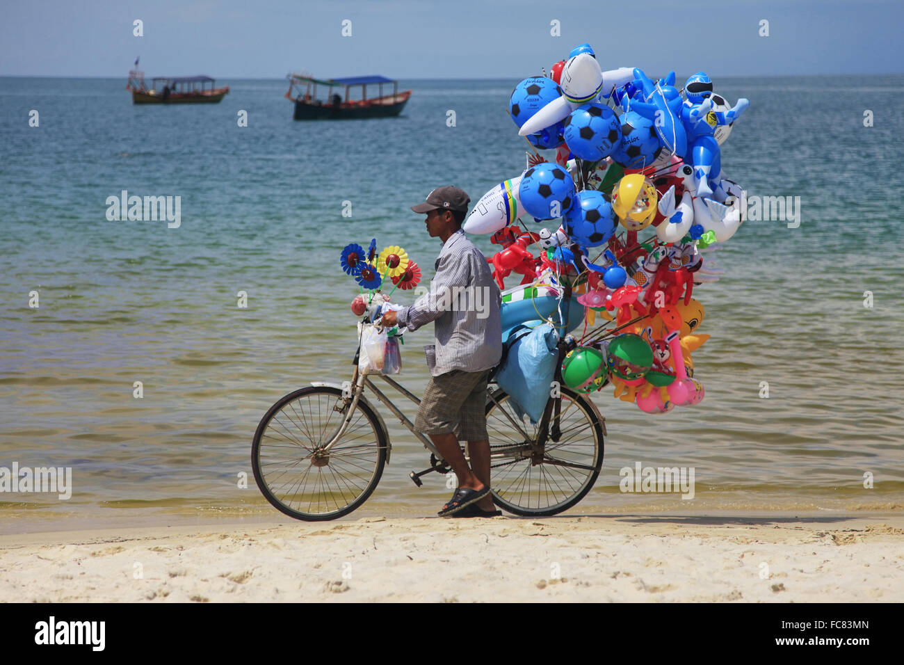 boy selling balloons Stock Photo - Alamy