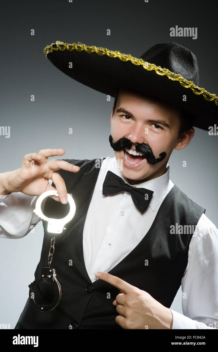 Person wearing sombrero hat in funny concept Stock Photo - Alamy