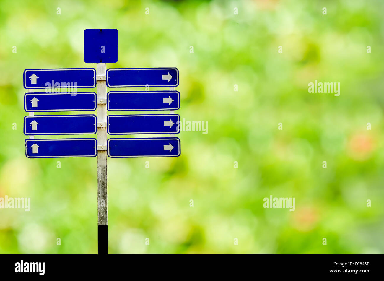 Road Sign on green nature background Stock Photo - Alamy