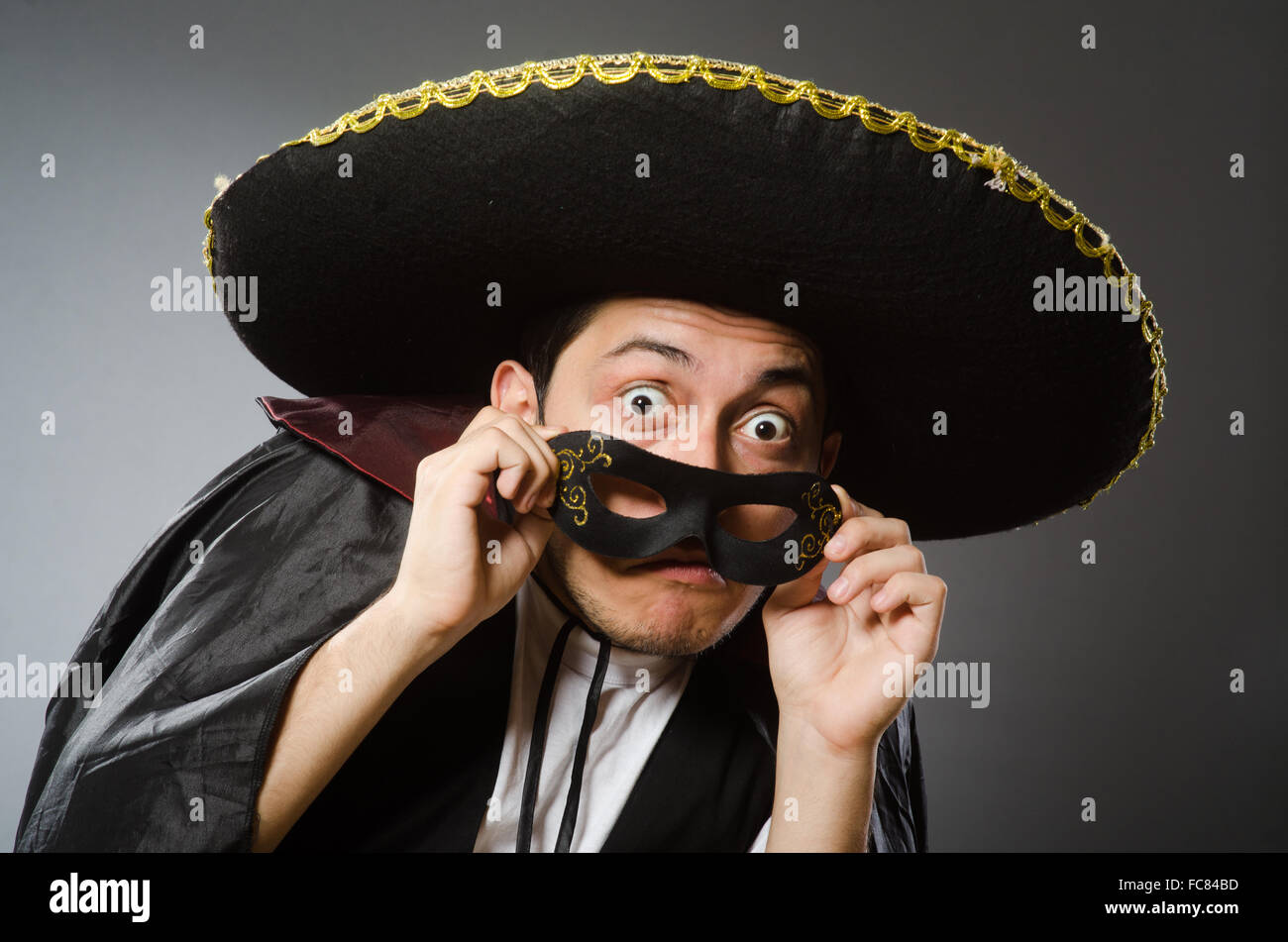 Person wearing sombrero hat in funny concept Stock Photo - Alamy