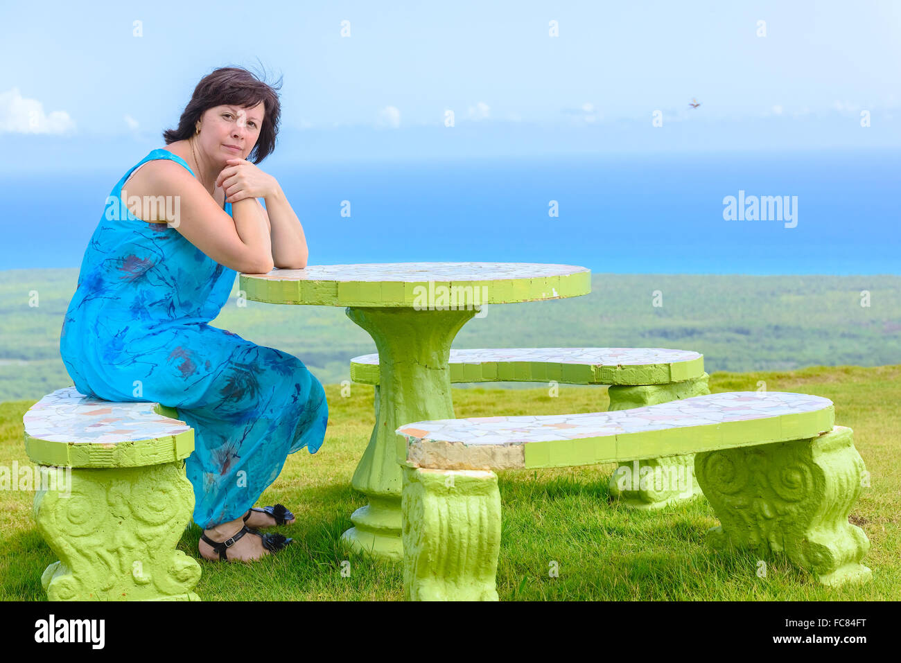 woman sitting at the table Stock Photo - Alamy