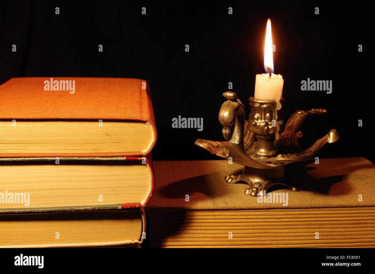 Old books candles hi-res stock photography and images - Alamy