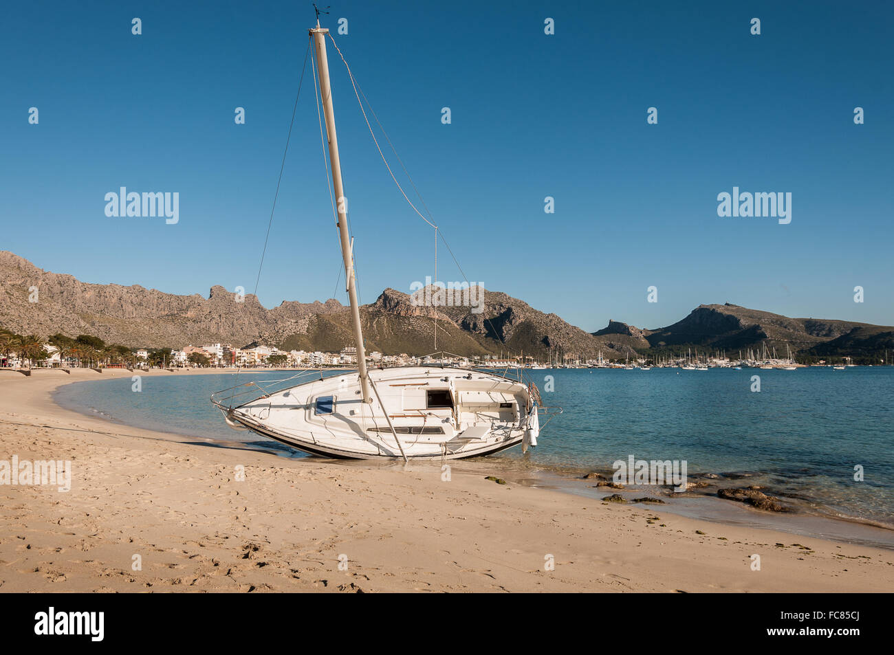 Boat stranded on the beach after a storm Stock Photo - Alamy