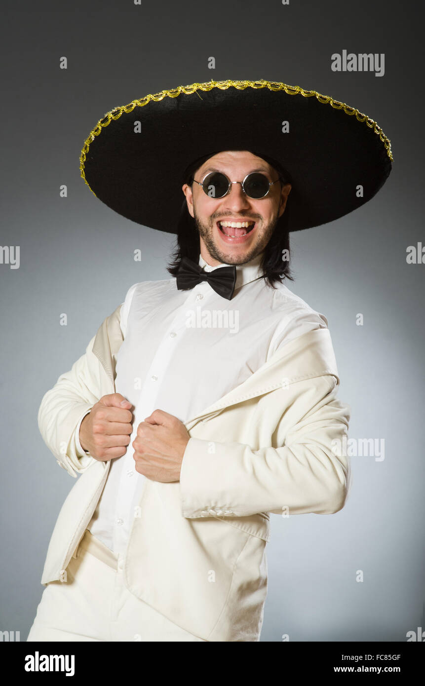 Person wearing sombrero hat in funny concept Stock Photo - Alamy