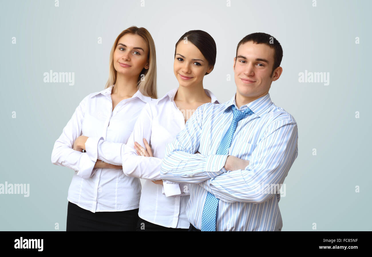 Group of three successful young business persons together Stock Photo ...