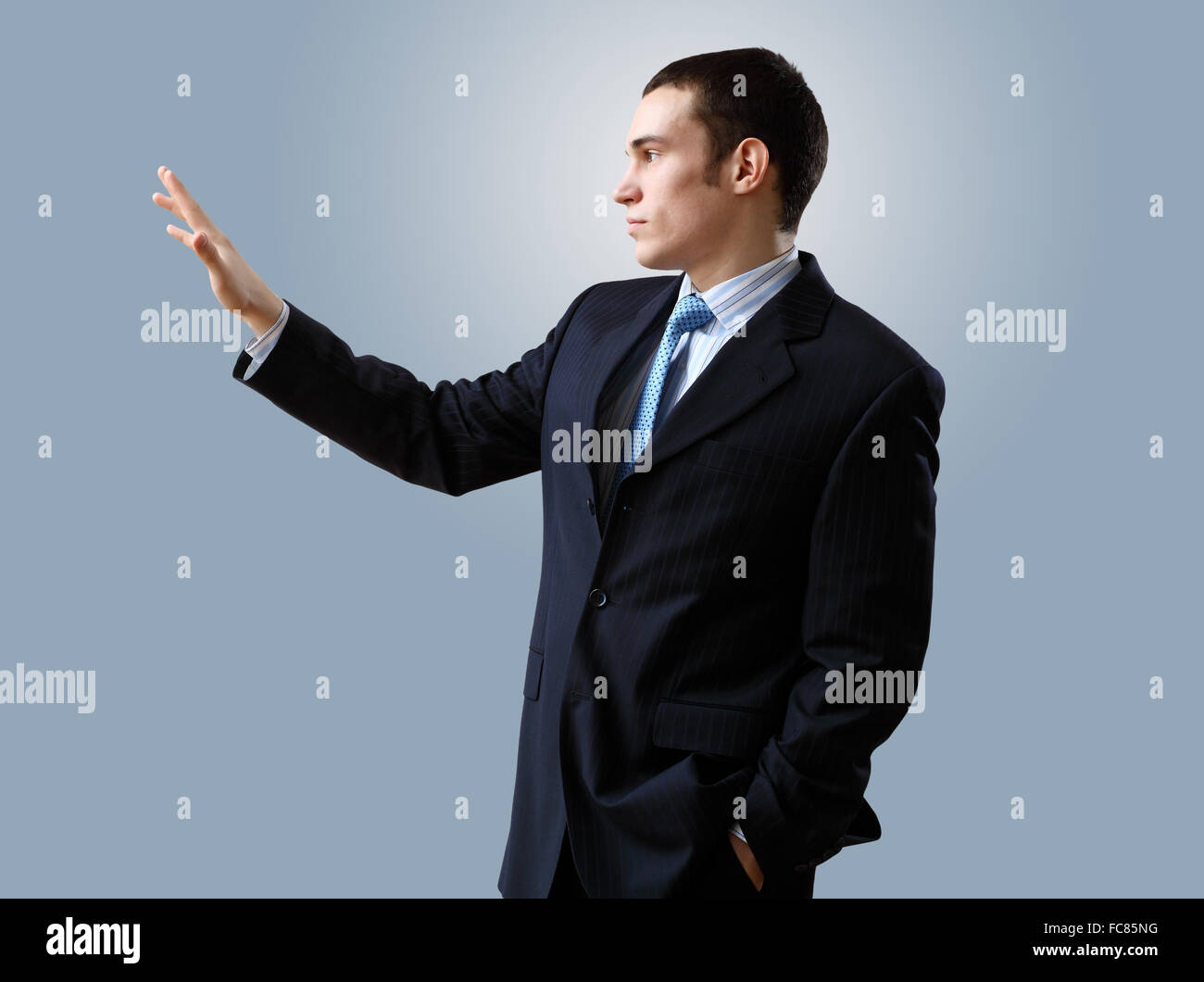 Portrait of a man in business wear making presentation hi-res stock ...
