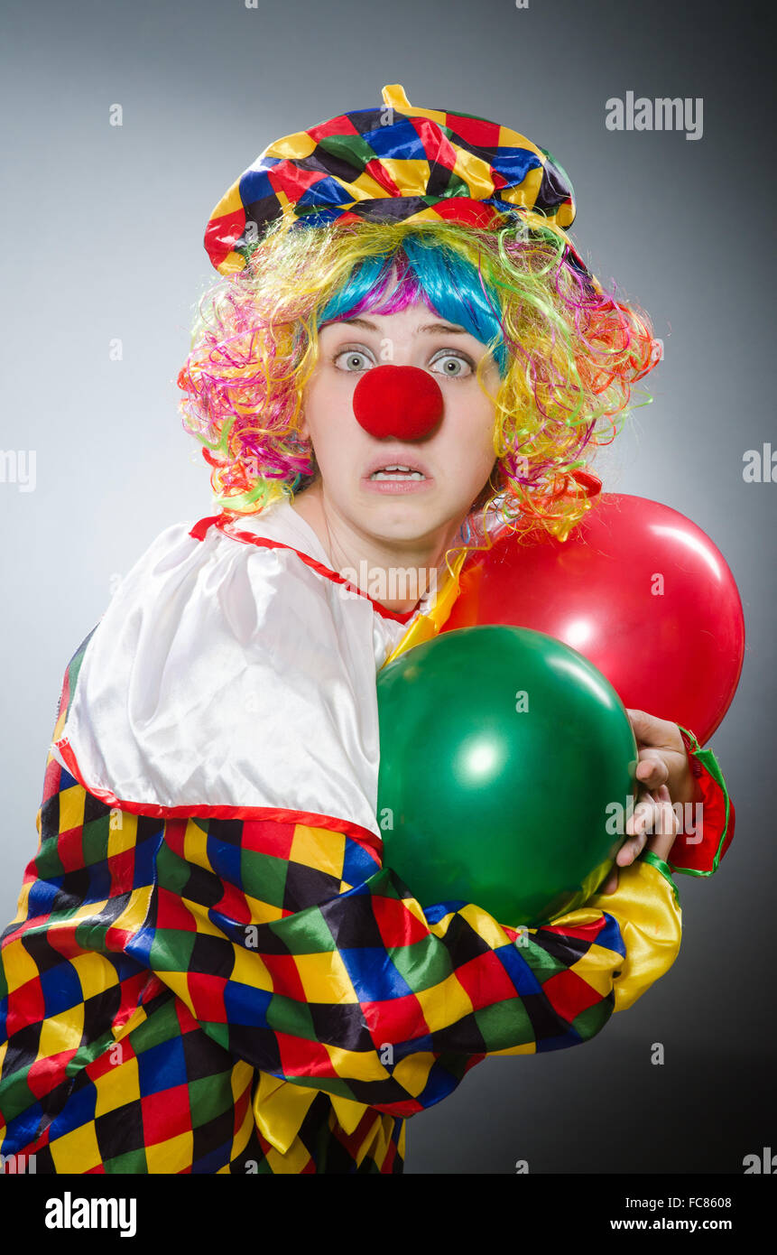 Funny clown in comical concept Stock Photo - Alamy