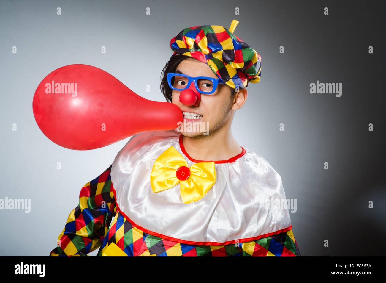 Funny clown in comical concept Stock Photo - Alamy