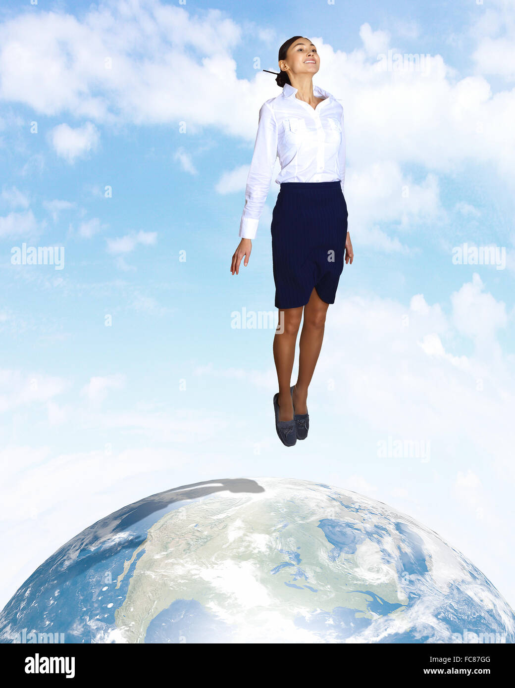 Young woman jumping up with our planet earth below Stock Photo - Alamy