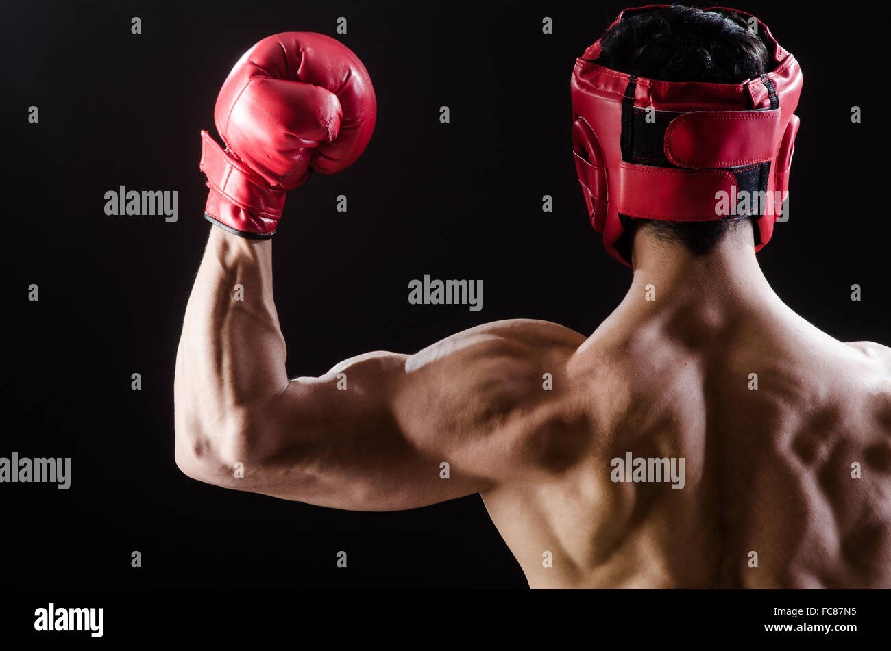 Muscular man in boxing concept Stock Photo - Alamy