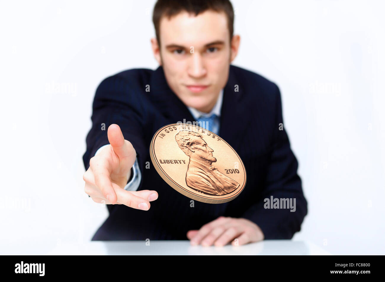 Person throwing a coin as symbol of risk and luck Stock Photo - Alamy