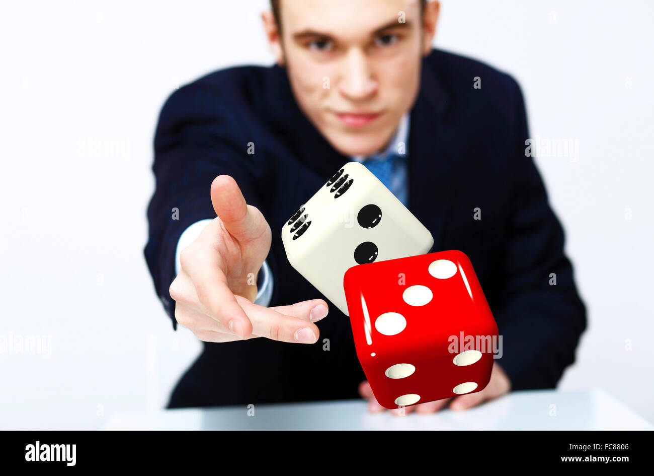 Image of a flying dice as symbol of risk and luck Stock Photo - Alamy