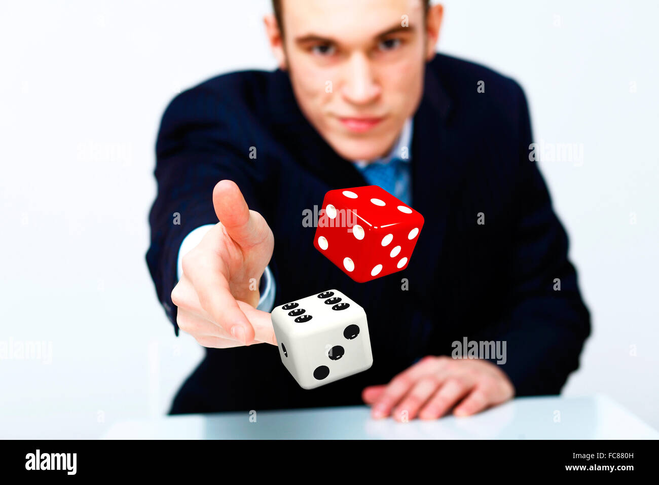 Image of a flying dice as symbol of risk and luck Stock Photo - Alamy