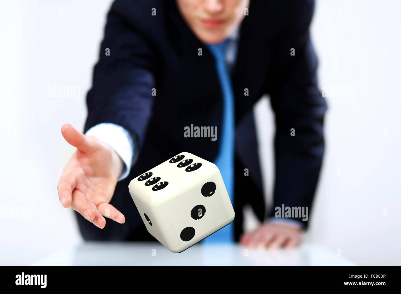 Image of a flying dice as symbol of risk and luck Stock Photo - Alamy