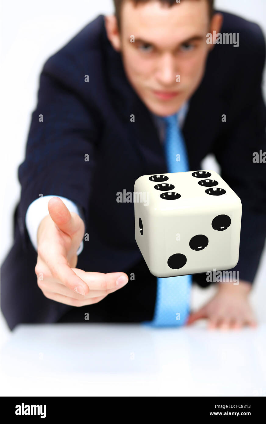 Image of a flying dice as symbol of risk and luck Stock Photo - Alamy