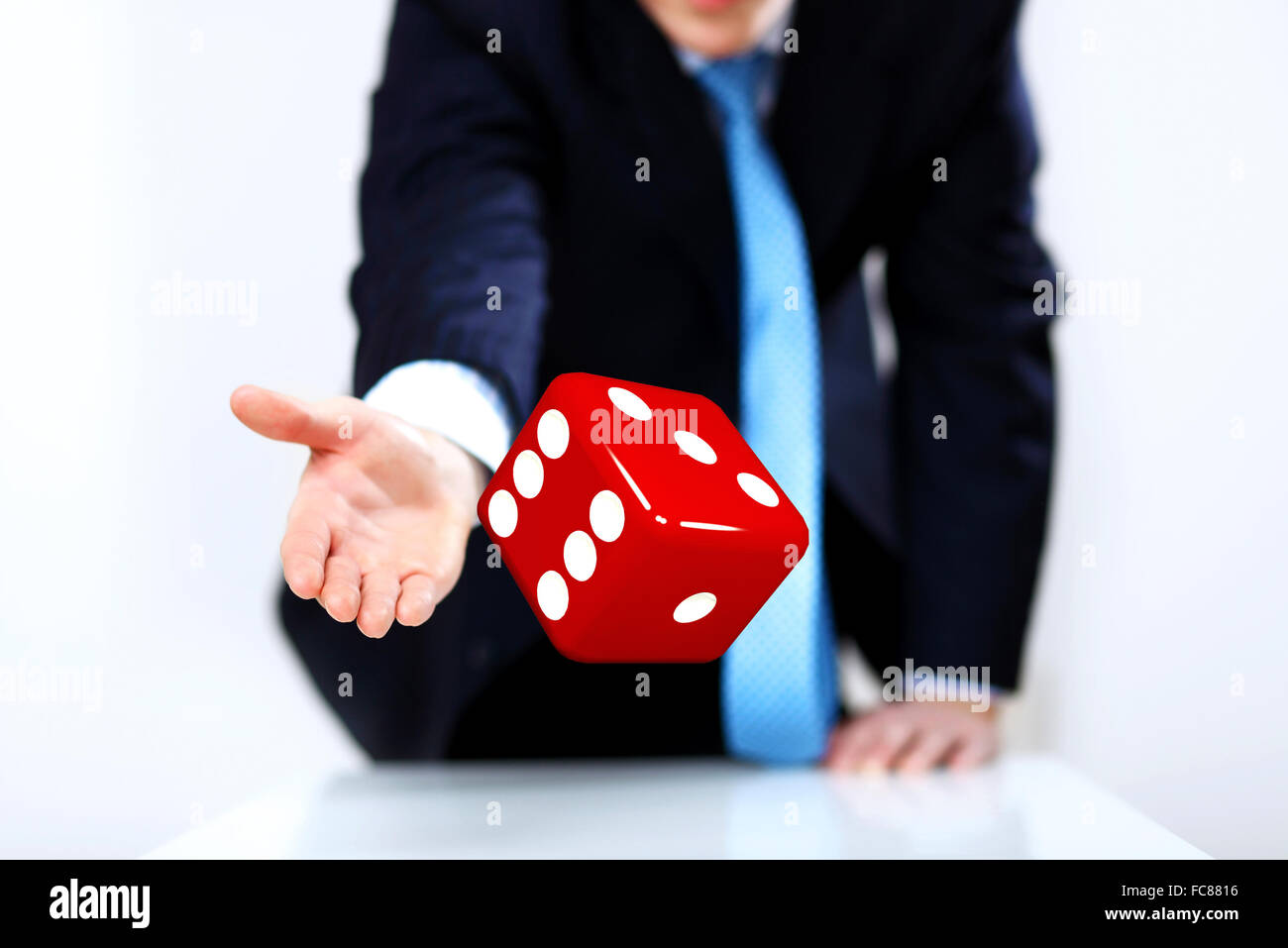 Image of a flying dice as symbol of risk and luck Stock Photo - Alamy