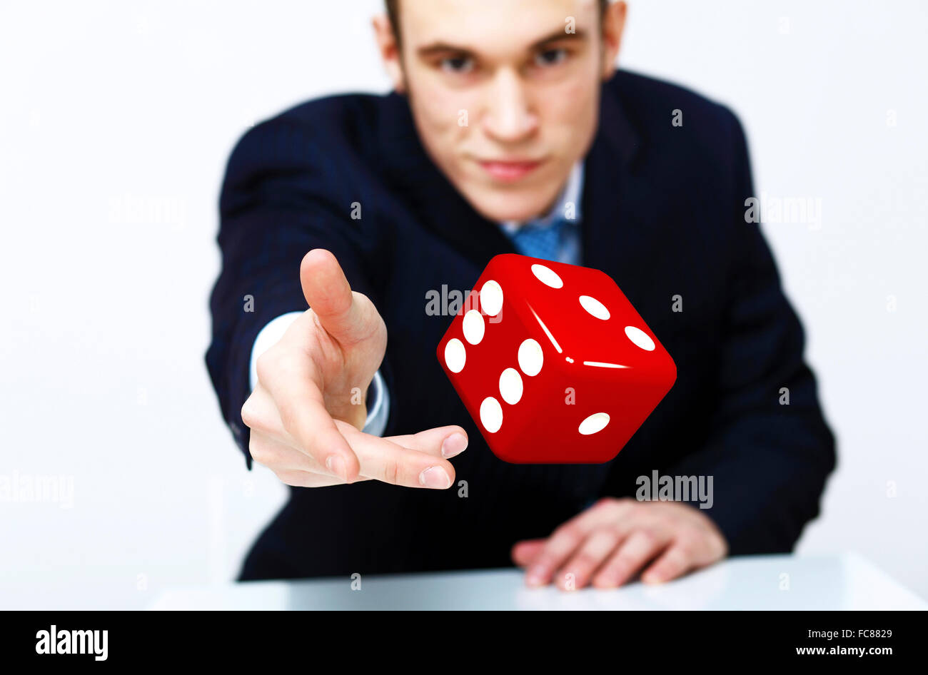 Image of a flying dice as symbol of risk and luck Stock Photo - Alamy