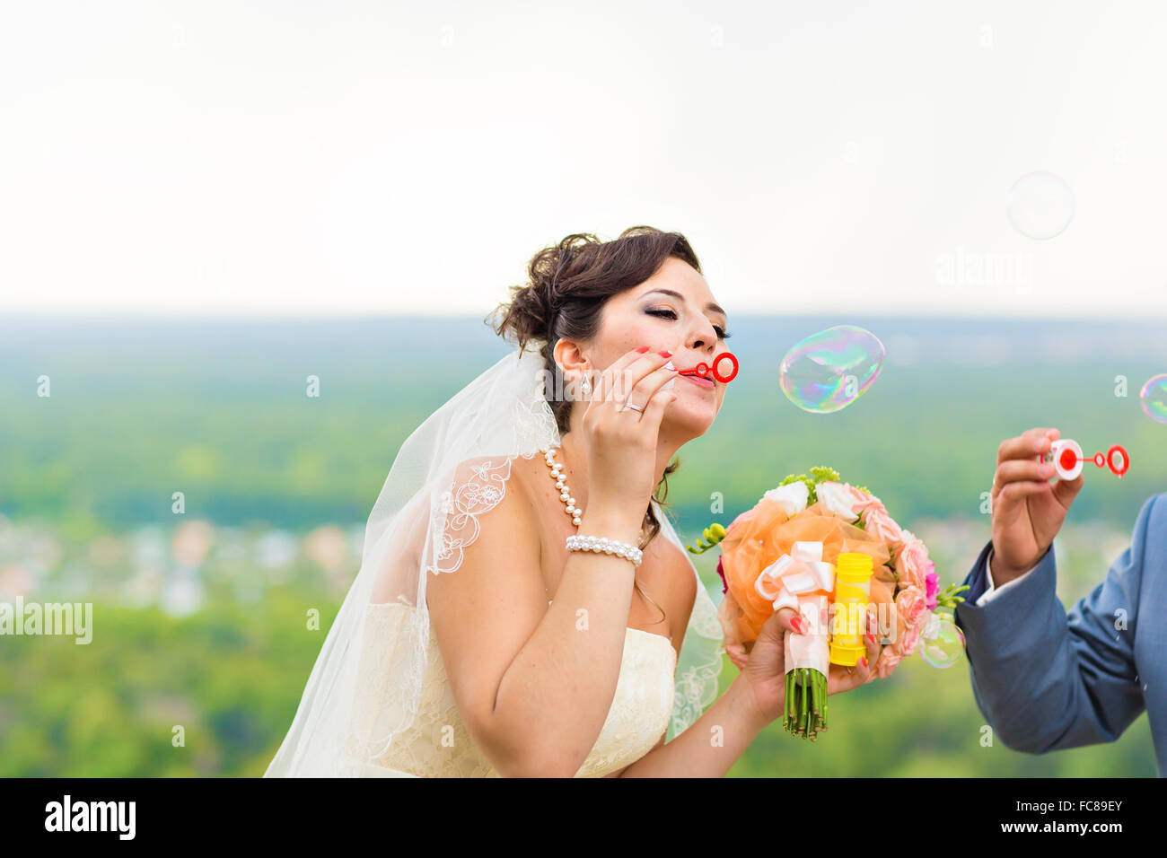 Woman wedding blowing kiss hi-res stock photography and images - Alamy