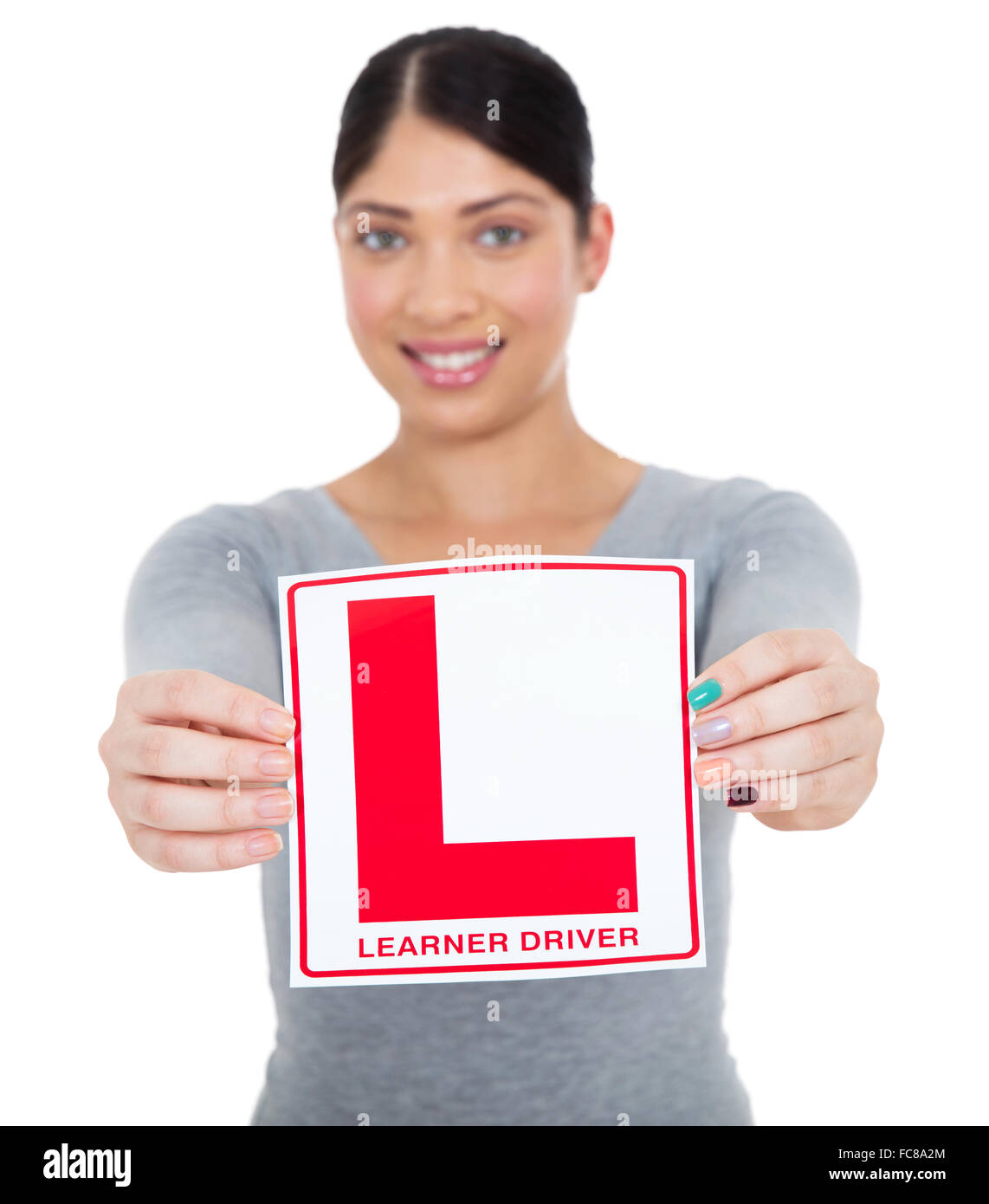 happy young woman presenting learner driver sign Stock Photo - Alamy